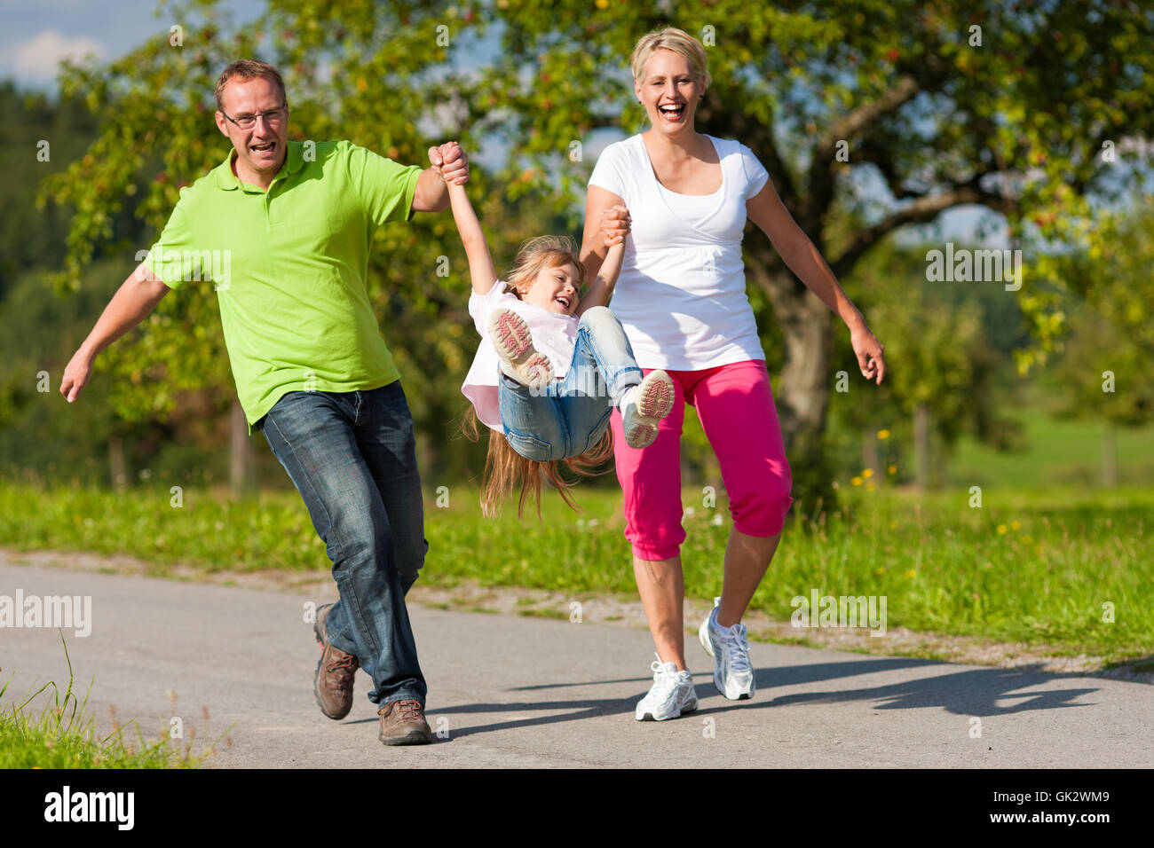 family makes walk in summer Stock Photo - Alamy