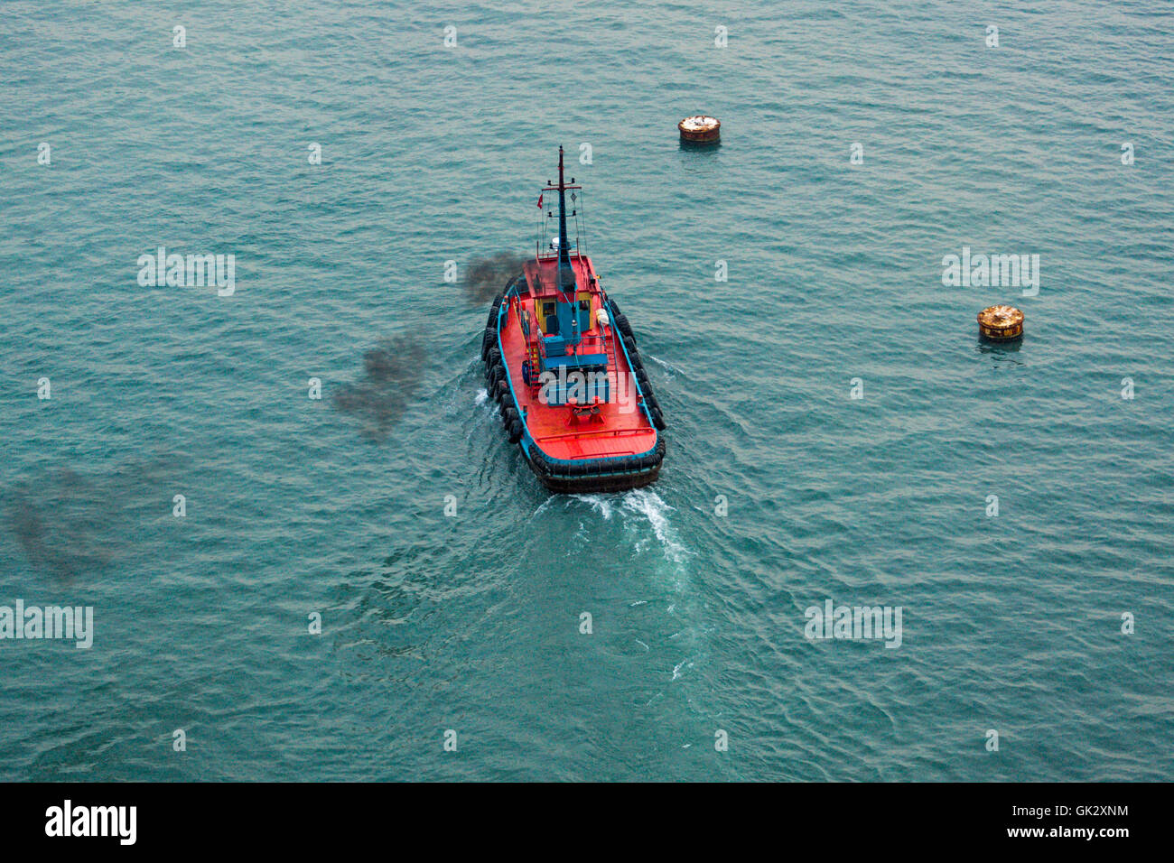 Helicopter view of a boat on the sea in a small Kowloon port, Hong Kong ...