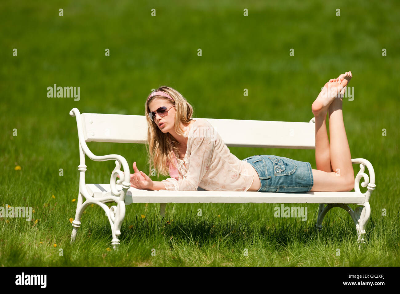 Sunbathing relax park bench hi-res stock photography and images - Alamy