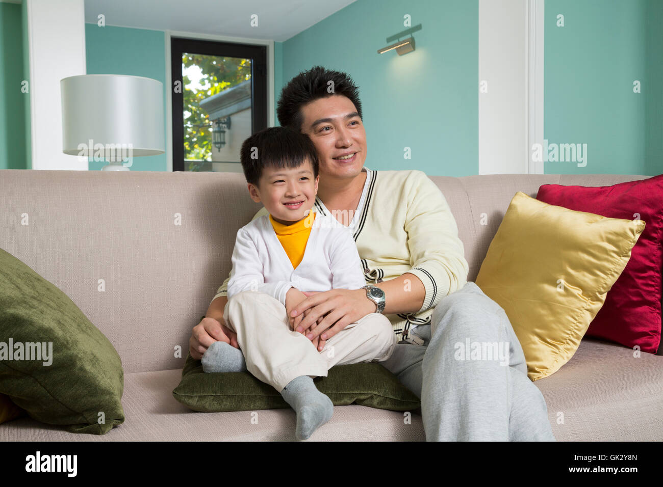 Father and son in the living room Stock Photo - Alamy