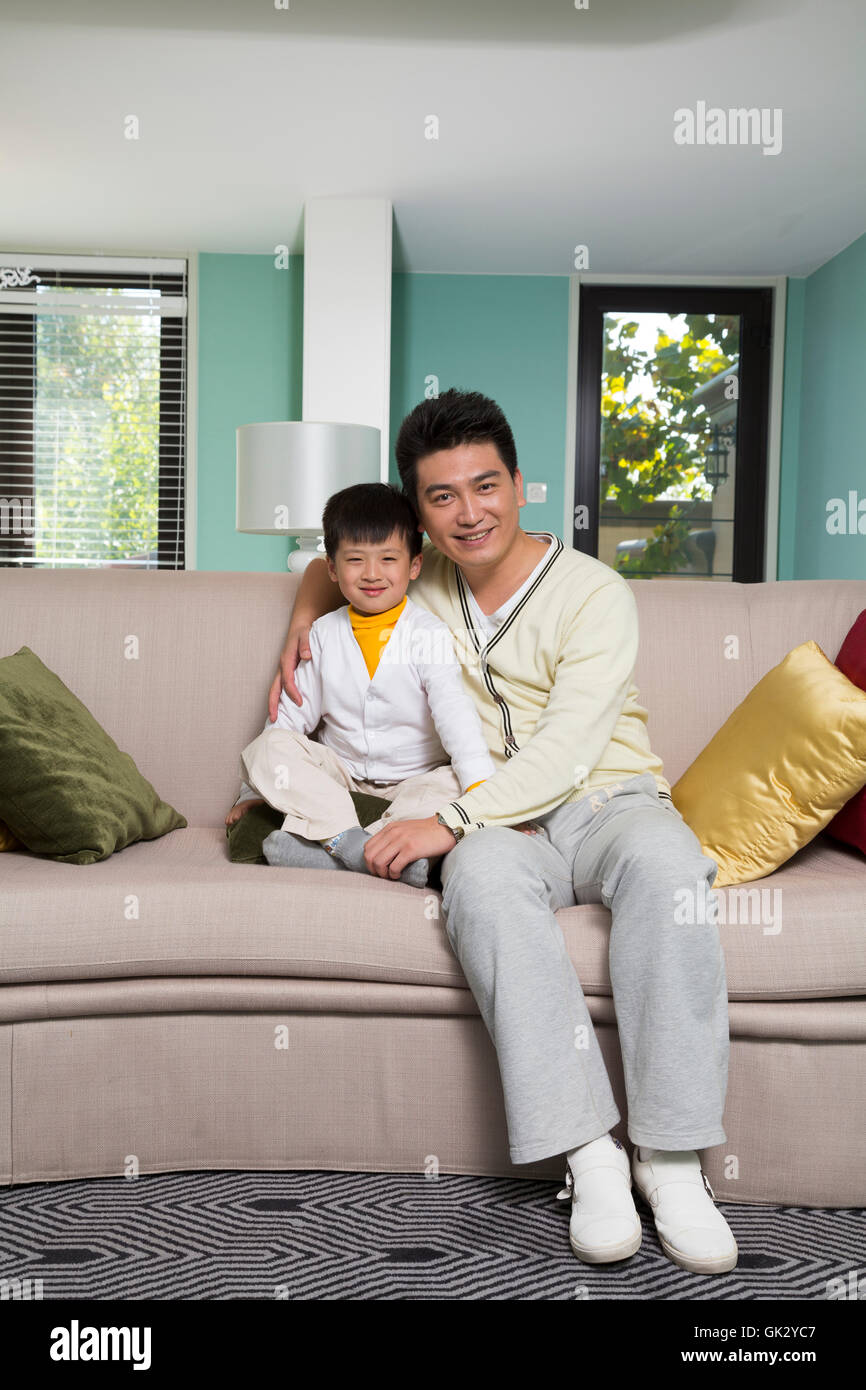 Father and son in the living room Stock Photo - Alamy