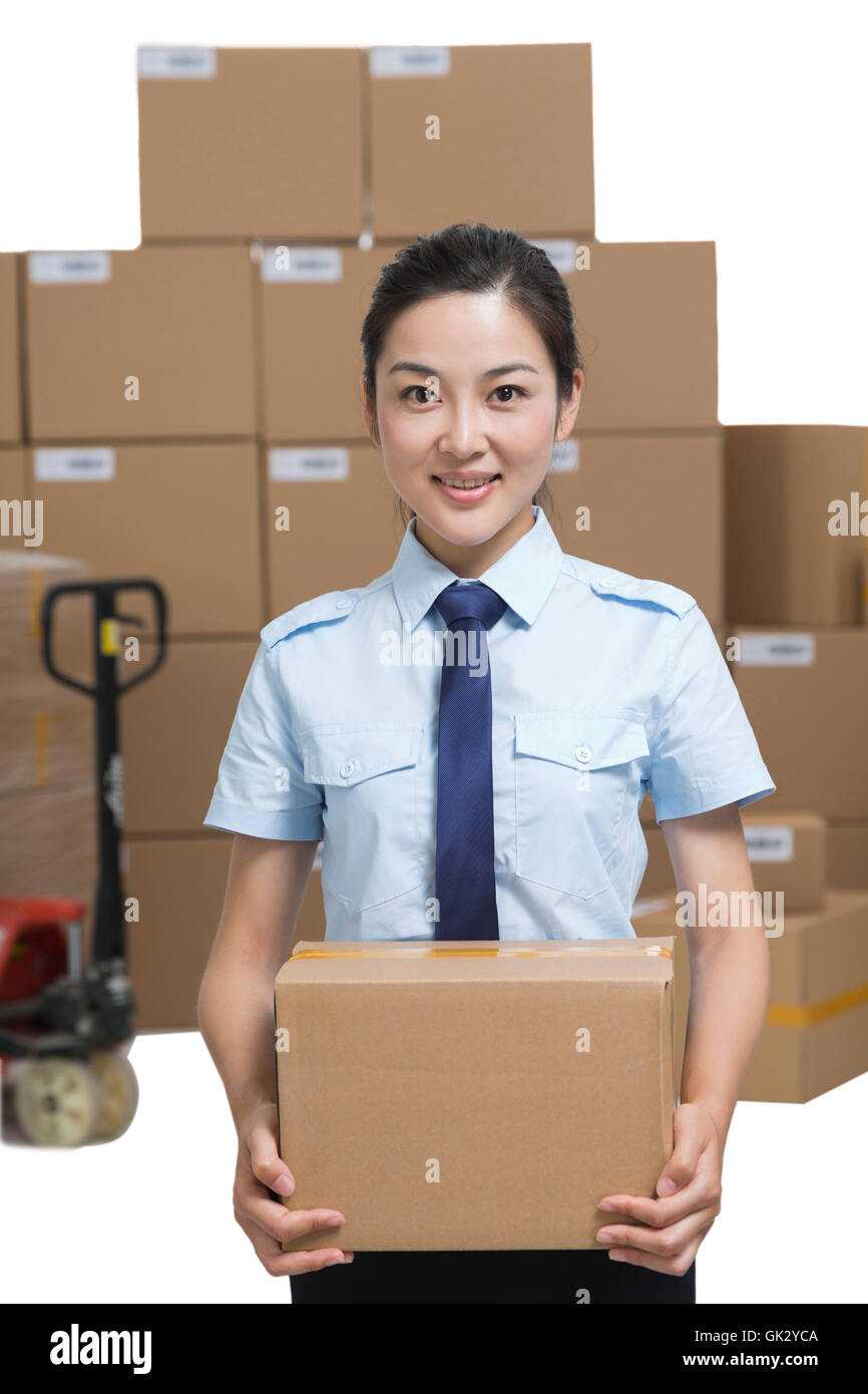 Logistics warehouse workers holding cardboard boxes Stock Photo - Alamy