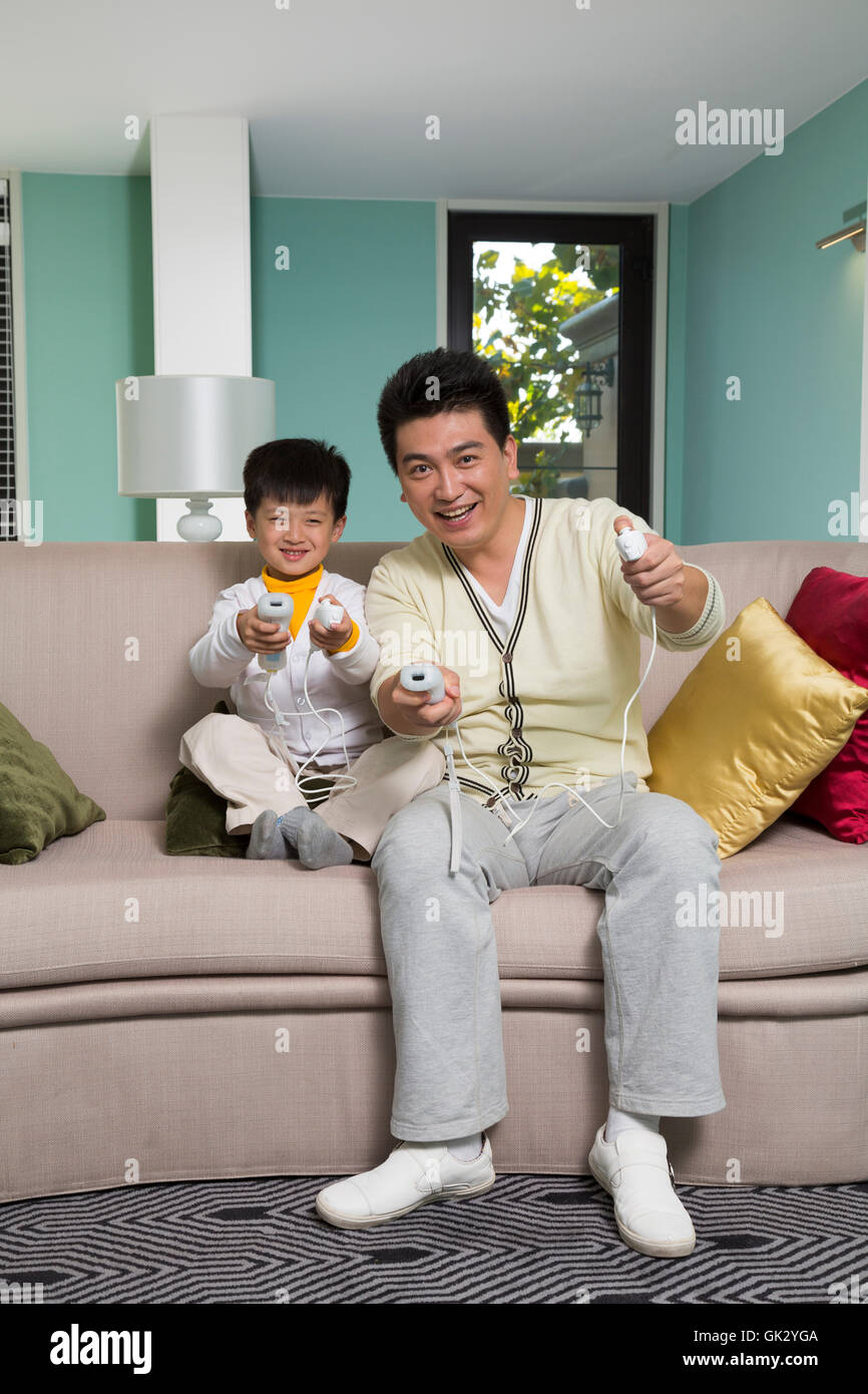 Father and son in the living room Stock Photo - Alamy