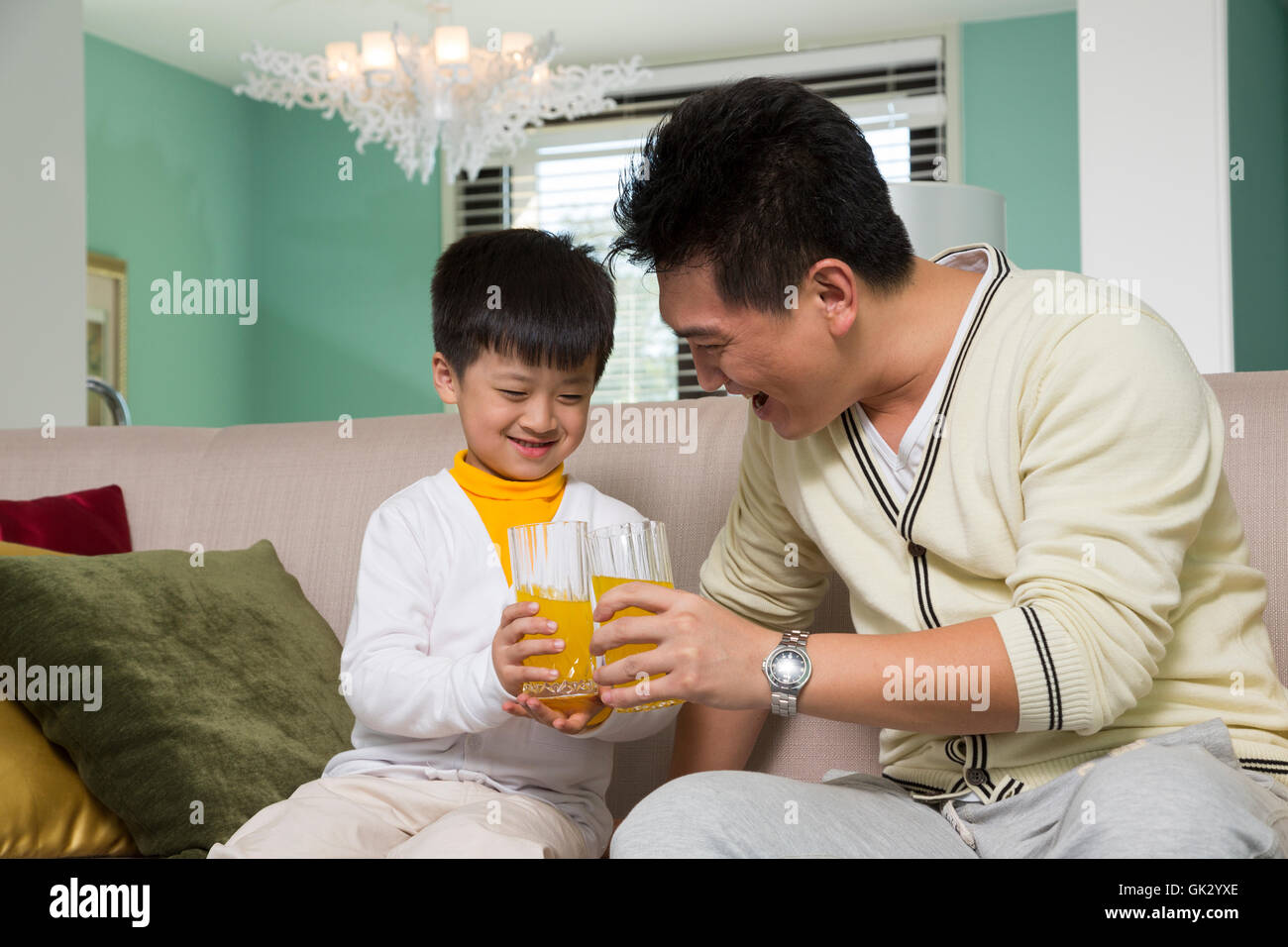 Father and son in the living room Stock Photo - Alamy