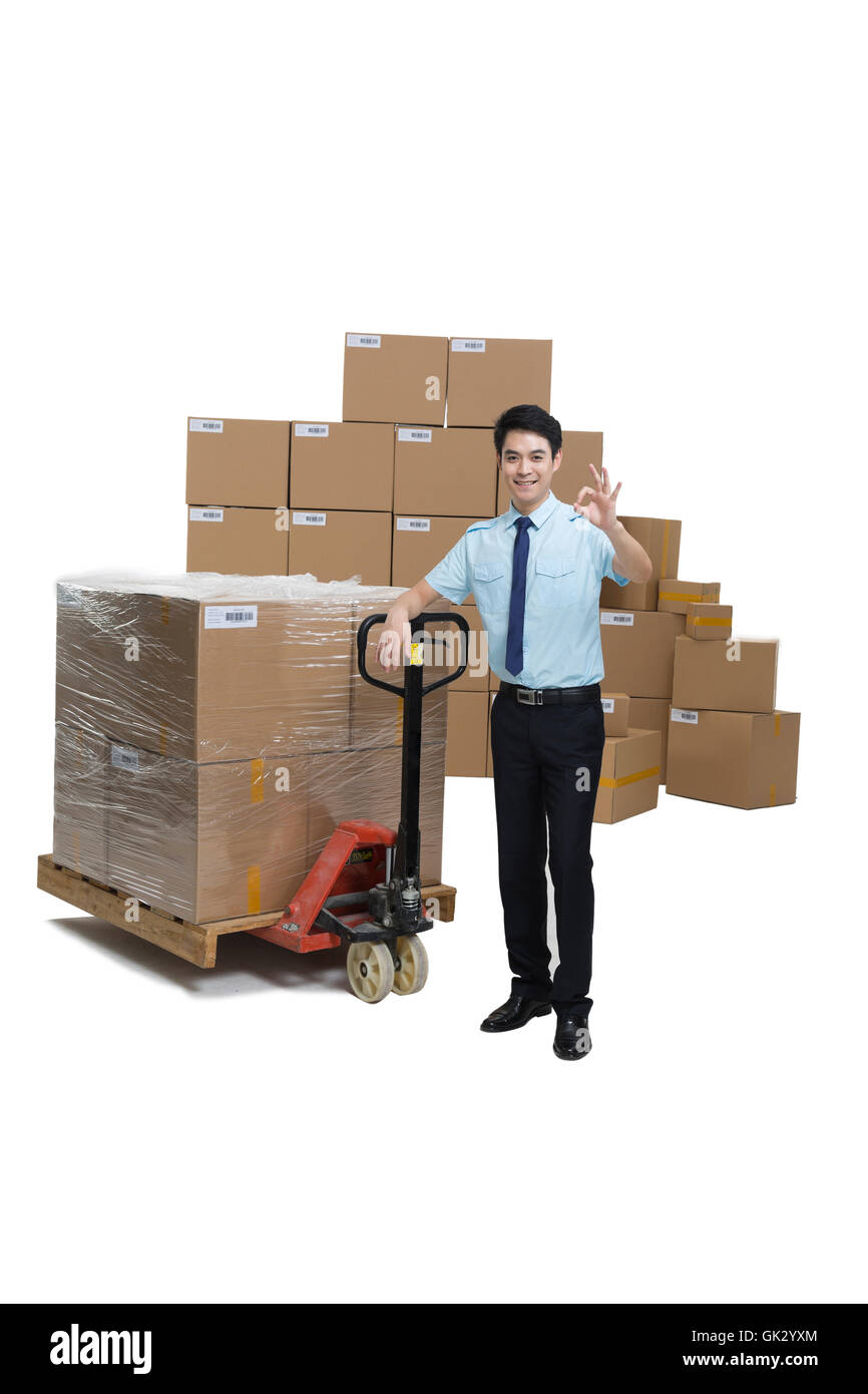 Logistics warehouse staff push carts carrying goods Stock Photo - Alamy