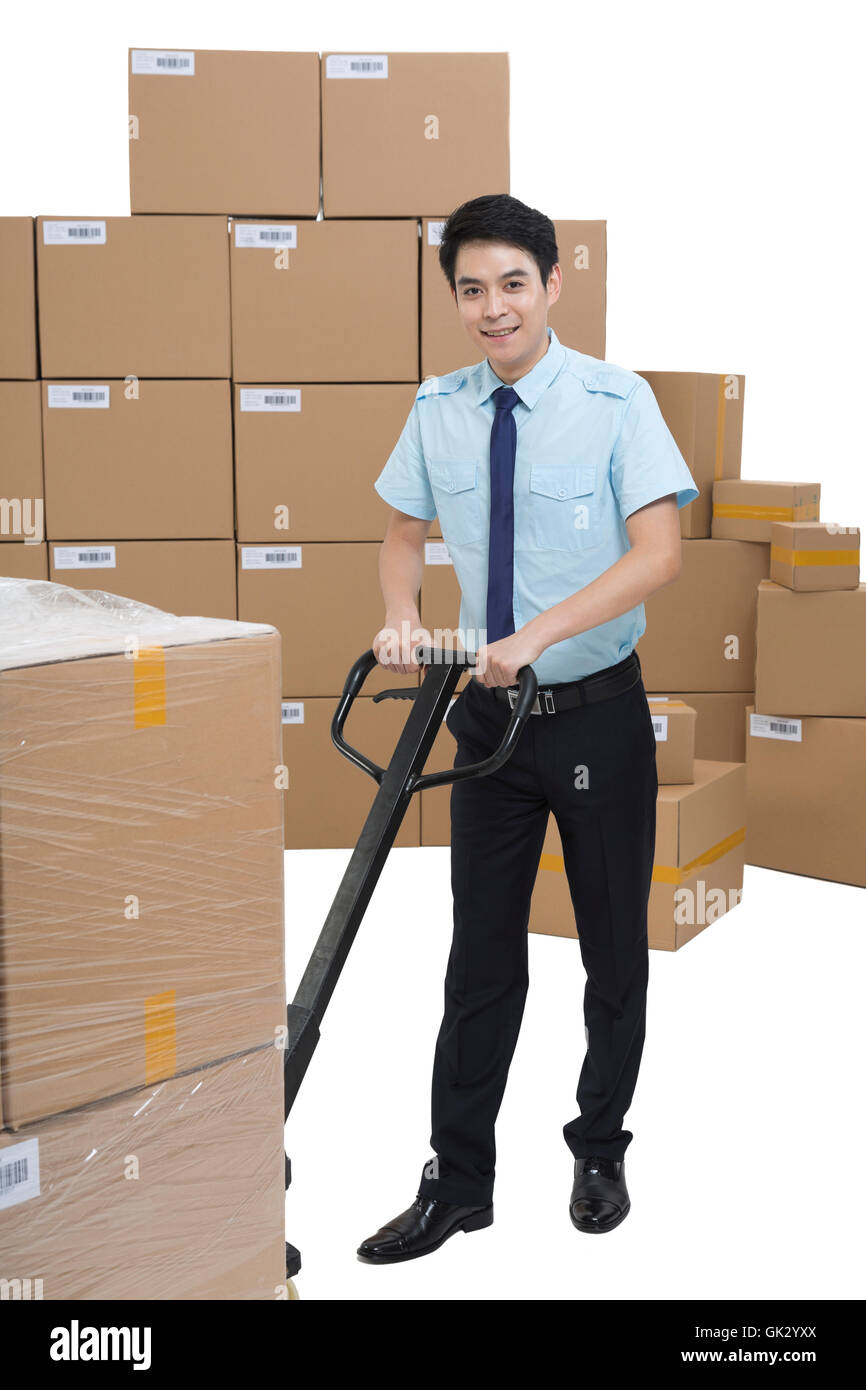 Logistics warehouse staff push carts carrying goods Stock Photo - Alamy