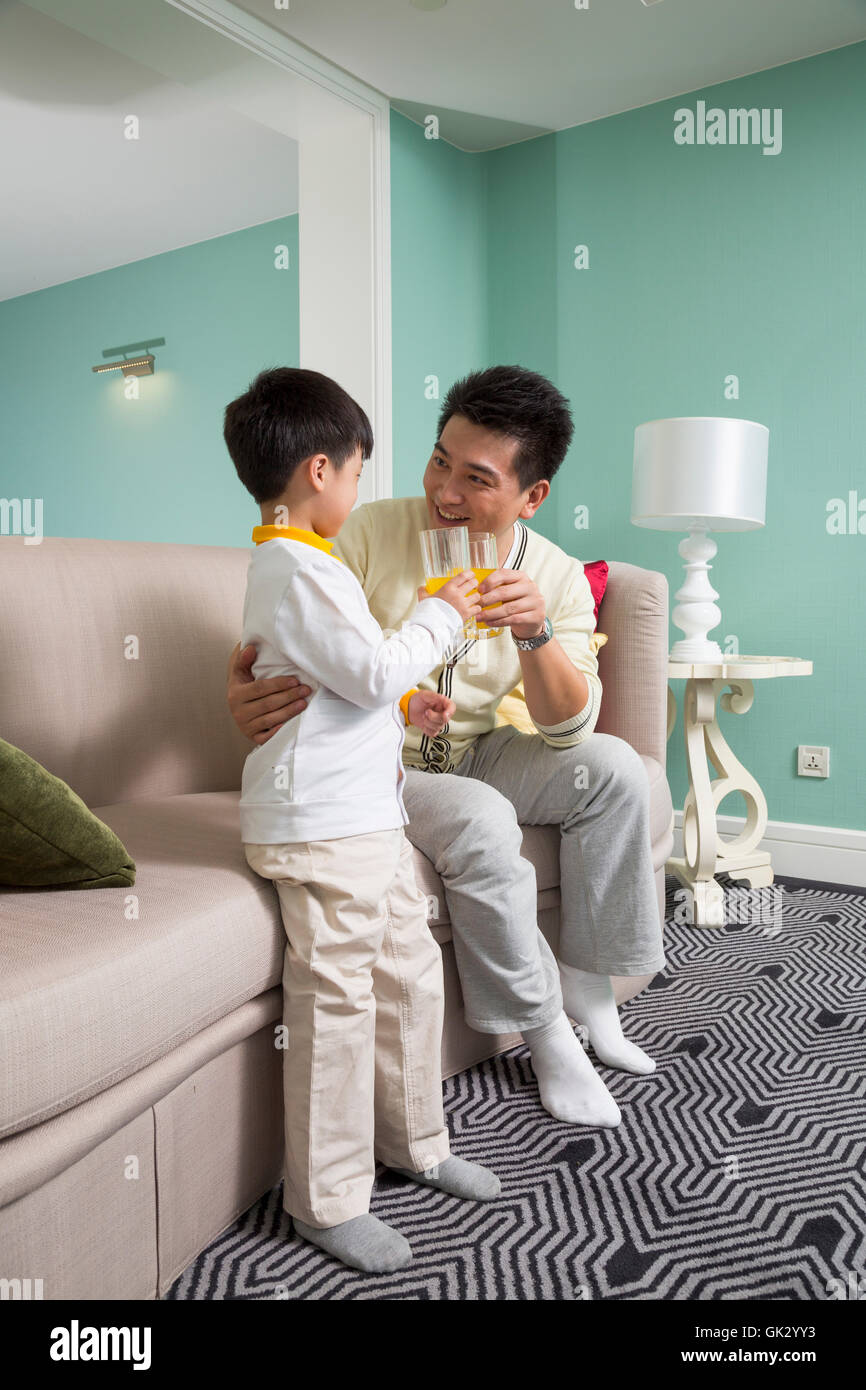 Father and son in the living room Stock Photo - Alamy