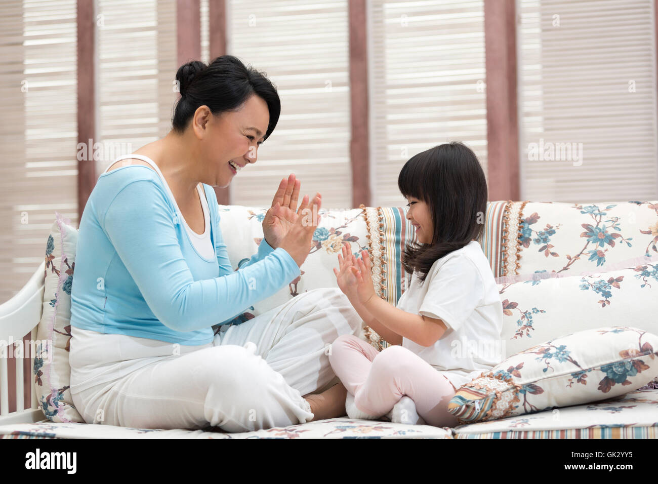 Happy grandchild clapping games Stock Photo - Alamy