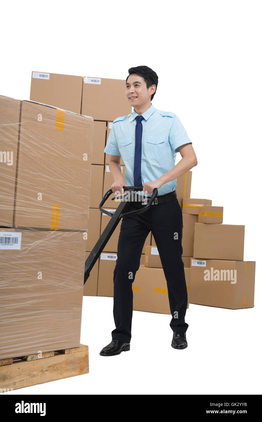 Logistics warehouse staff push carts carrying goods Stock Photo - Alamy