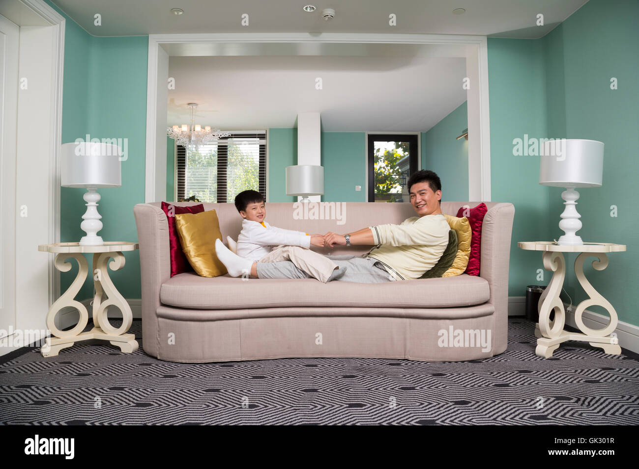 Father and son in the living room Stock Photo - Alamy