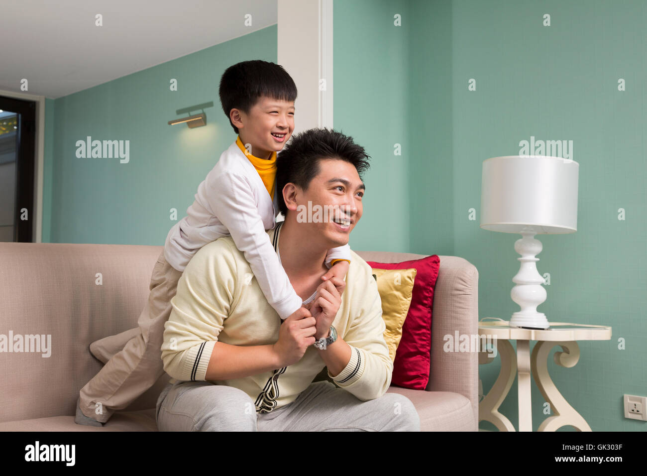 Father and son in the living room Stock Photo - Alamy