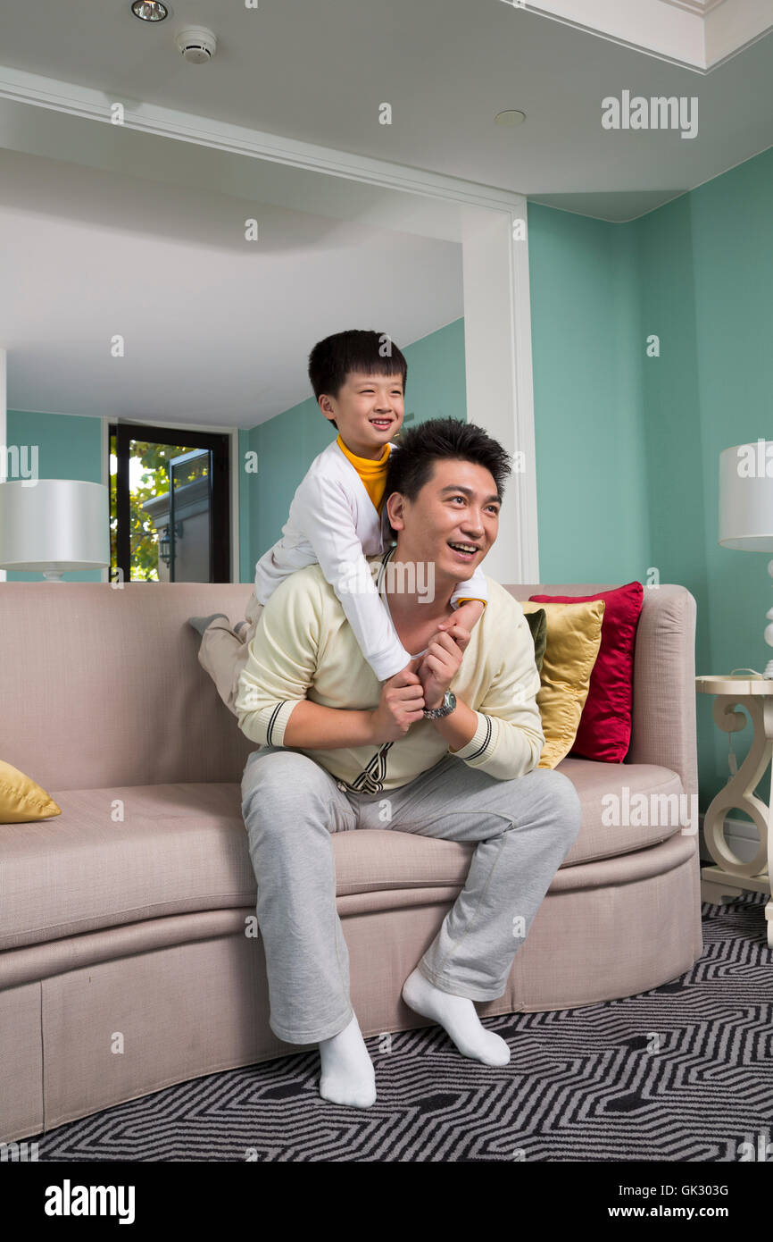 Father and son in the living room Stock Photo - Alamy