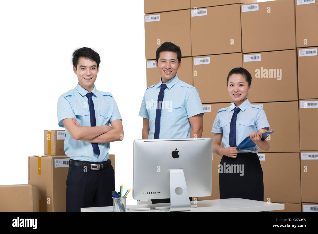 Logistics warehouse staff in the use of office computers Stock Photo ...