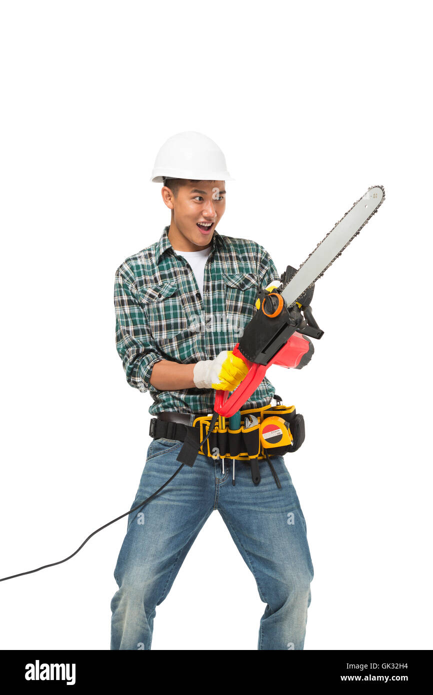Young construction workers take a chainsaw Stock Photo - Alamy