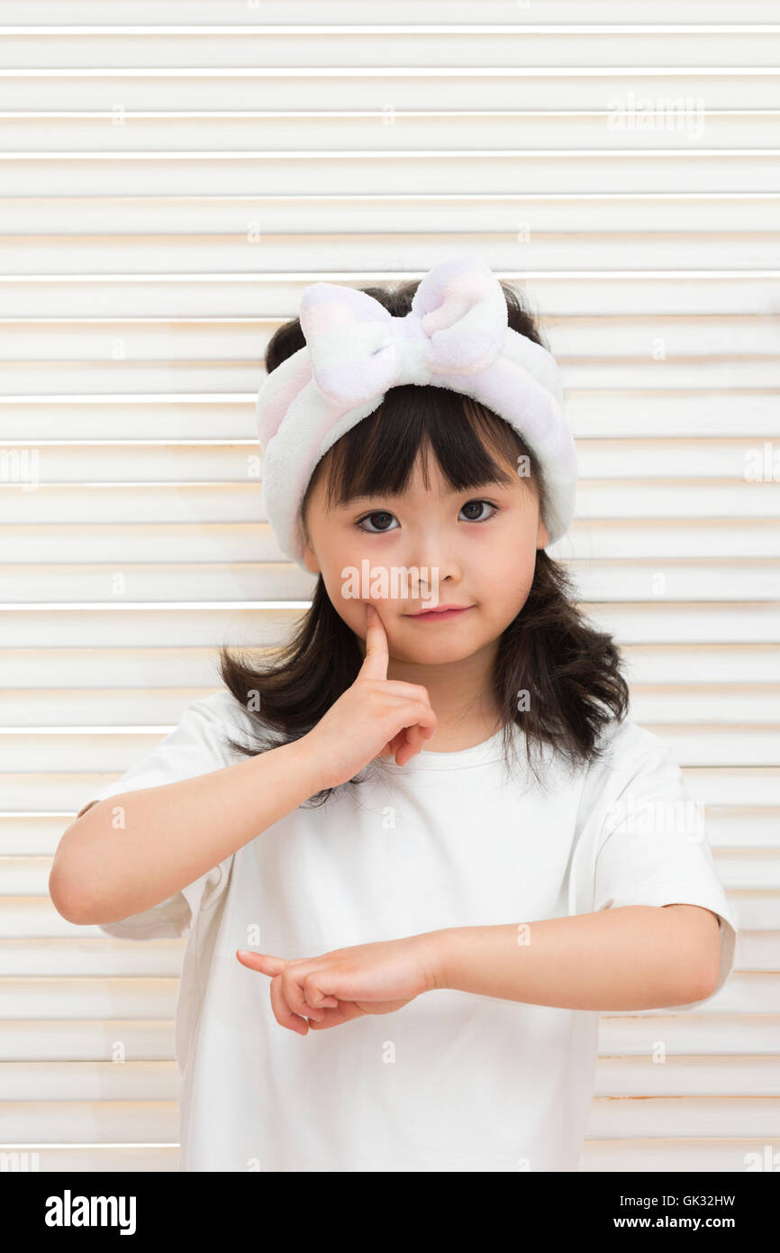 Cute little girl making faces Stock Photo - Alamy