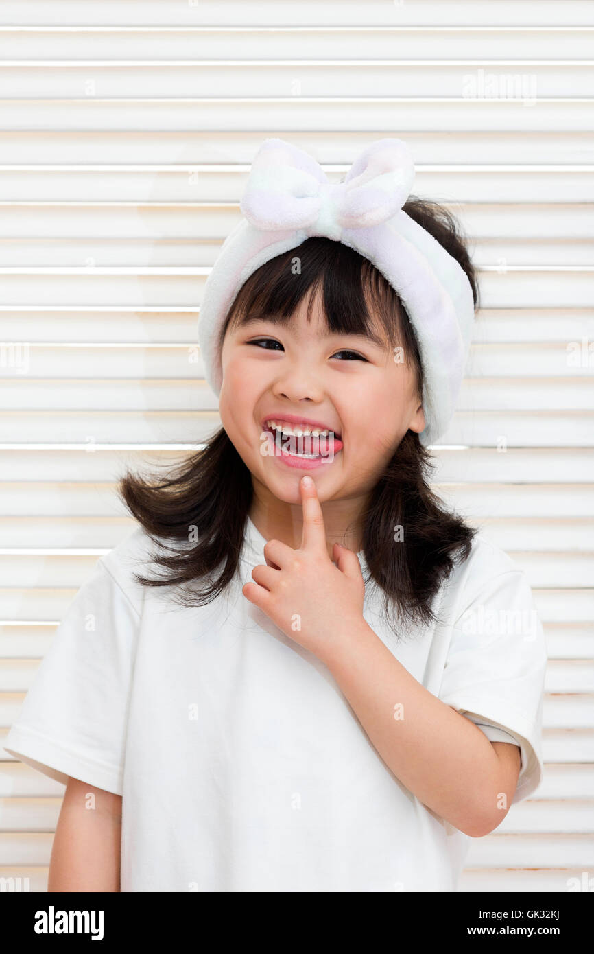 Cute little girl making faces Stock Photo - Alamy