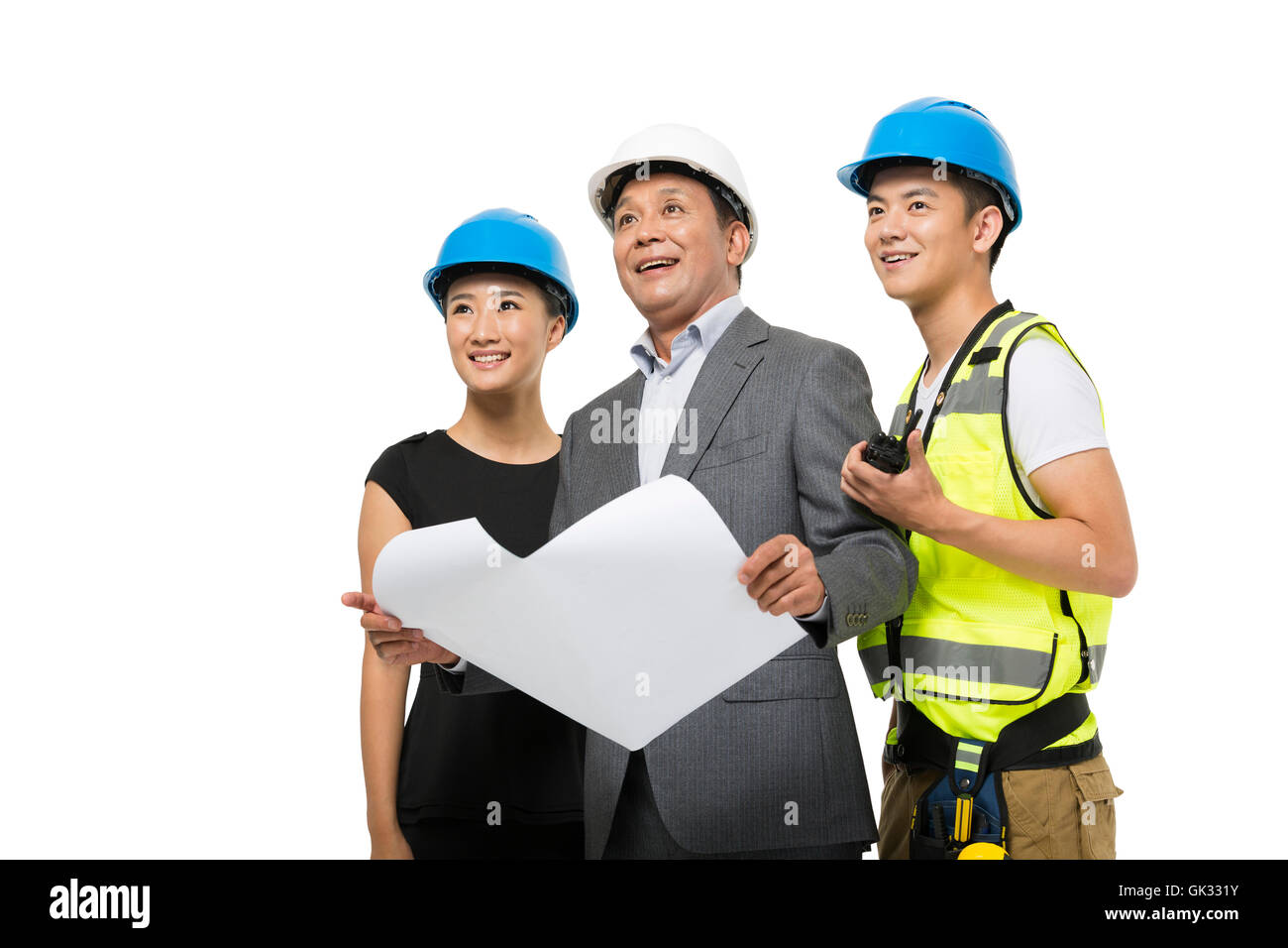 Architectural team holding a drawing Stock Photo - Alamy