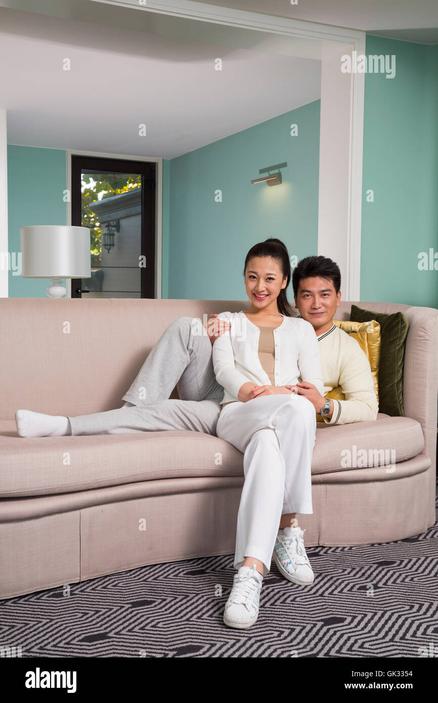 Couple in the living room Stock Photo - Alamy