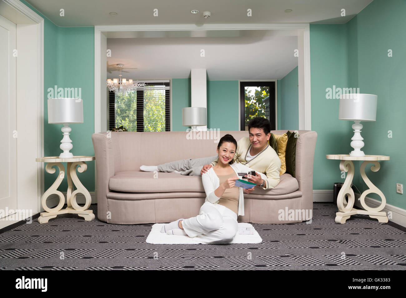 Couple in the living room Stock Photo - Alamy