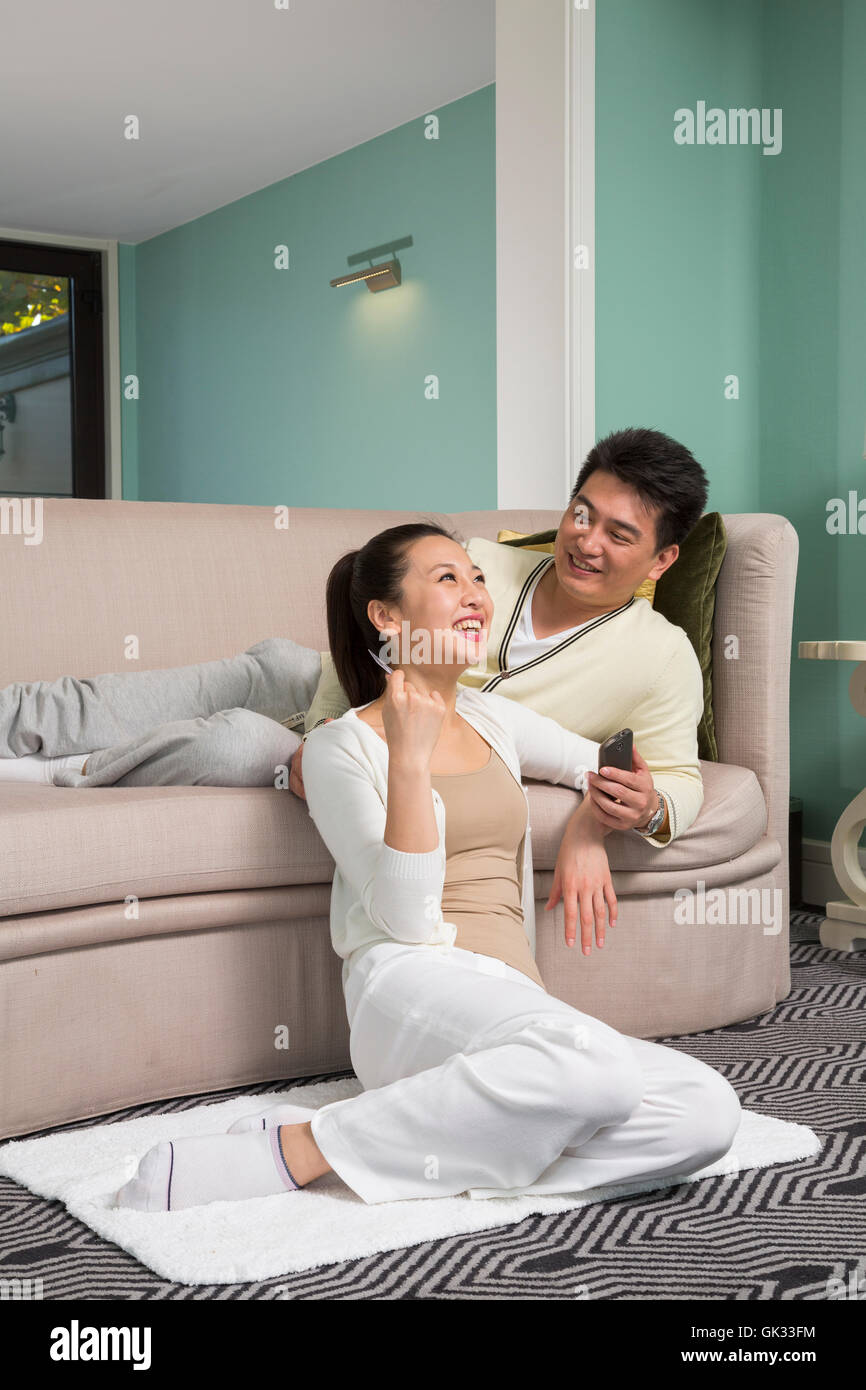 Couple in the living room Stock Photo - Alamy