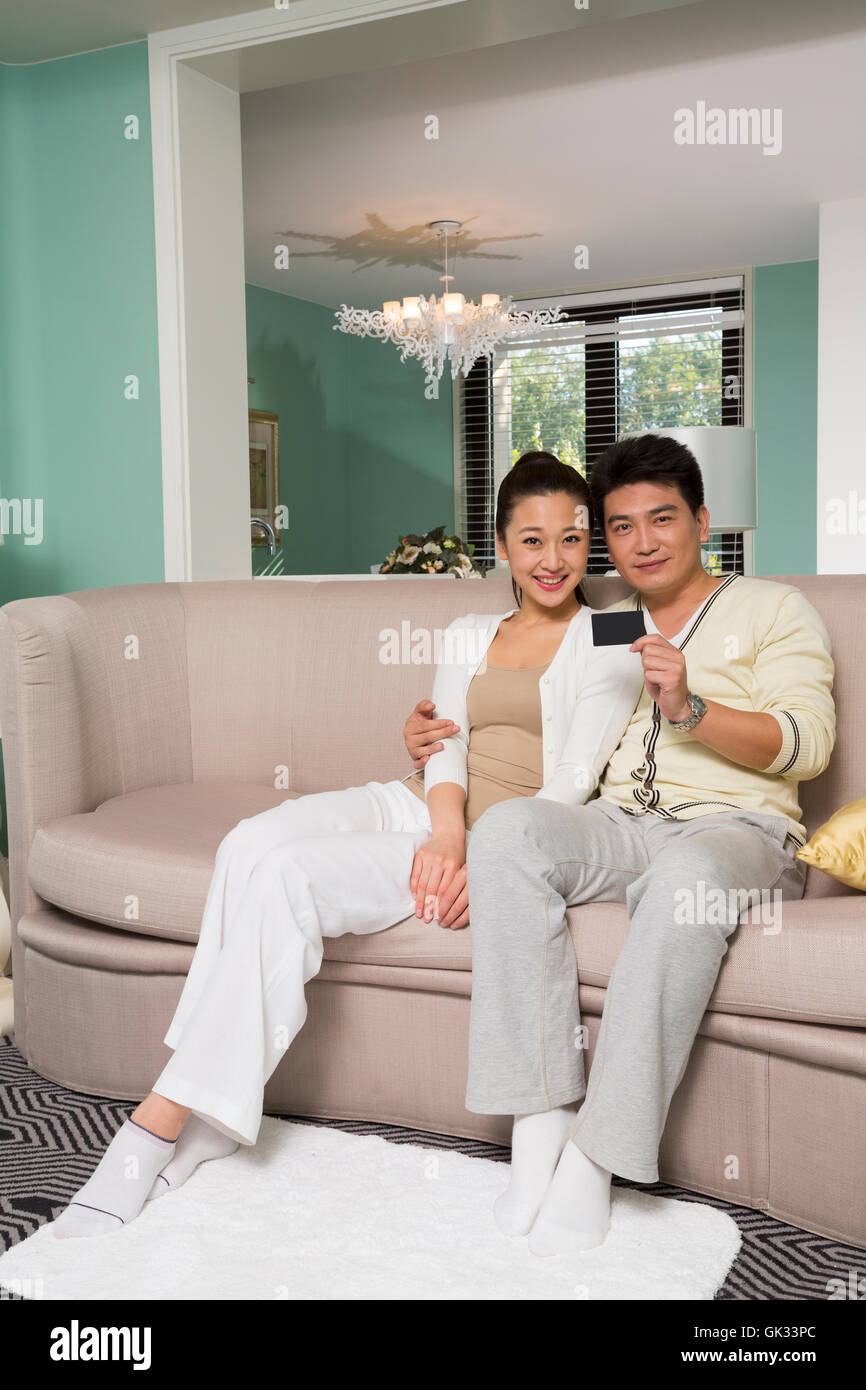 Couple in the living room Stock Photo - Alamy