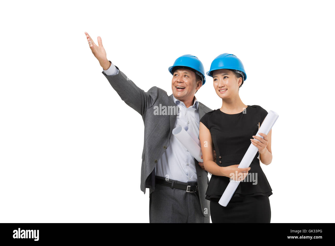 Construction engineer holding a drawing Stock Photo - Alamy