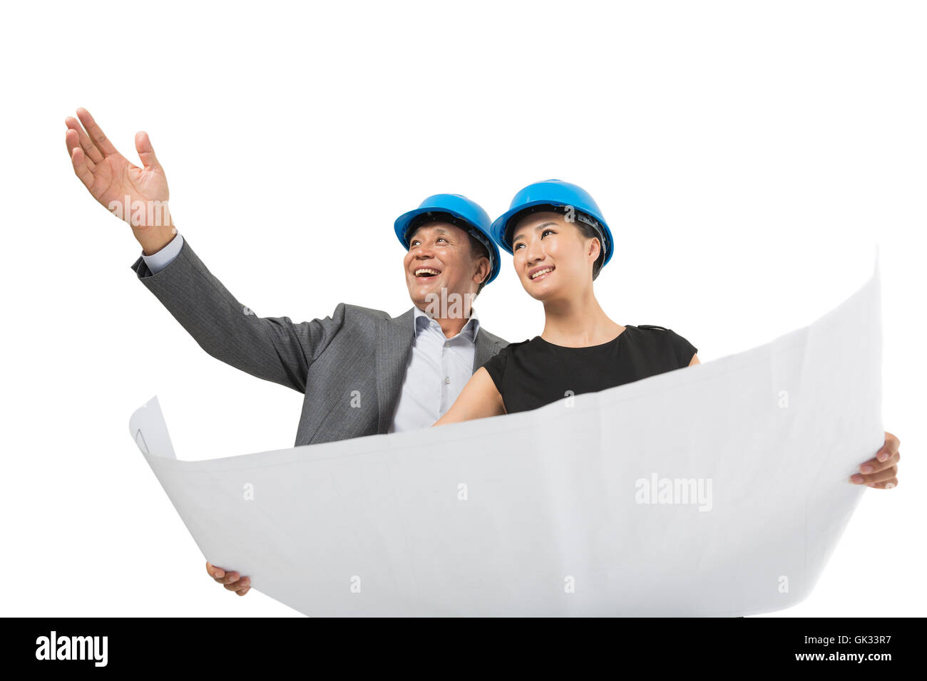 Construction engineer holding a drawing Stock Photo - Alamy