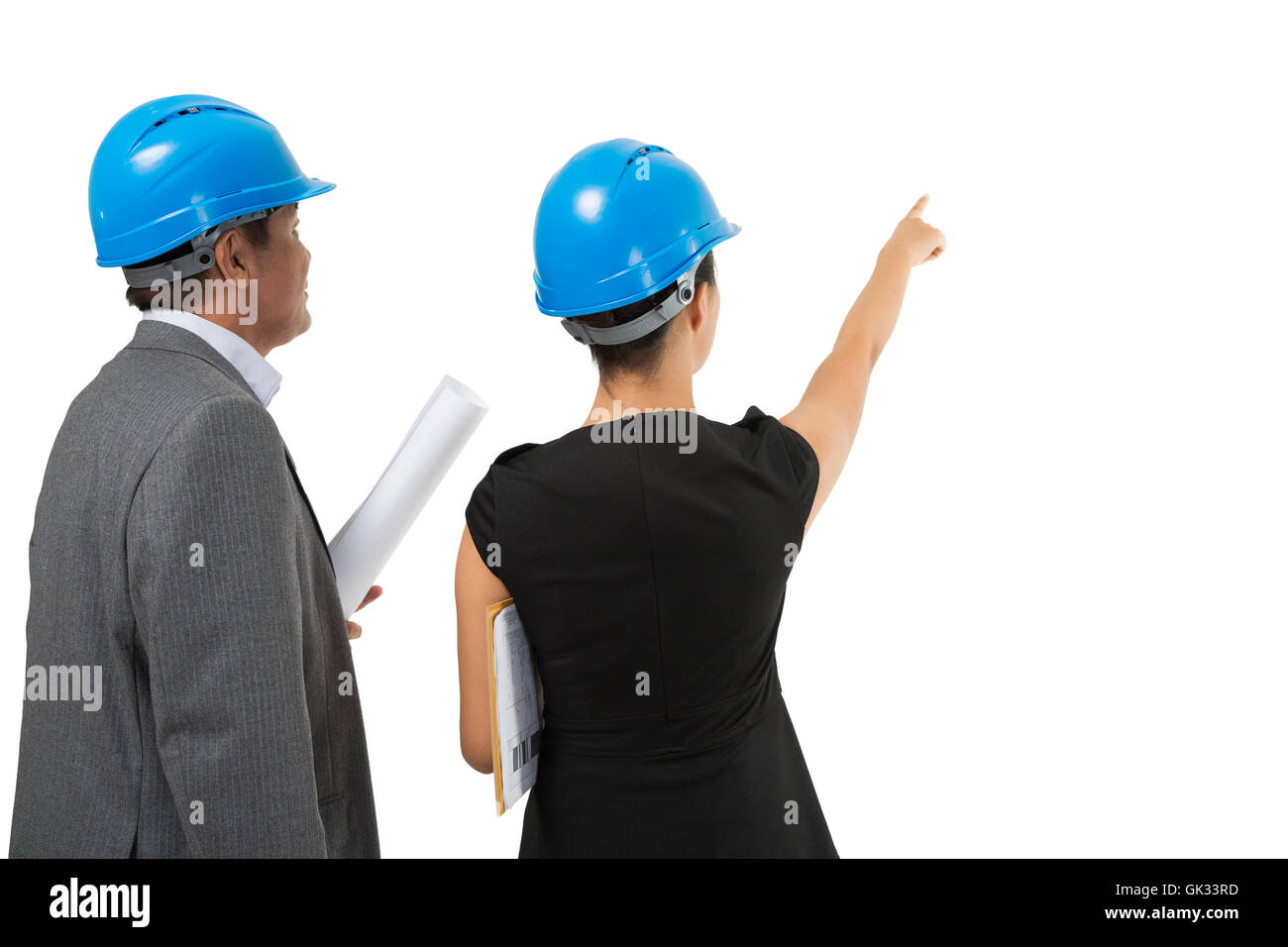 Construction engineer holding a drawing Stock Photo - Alamy