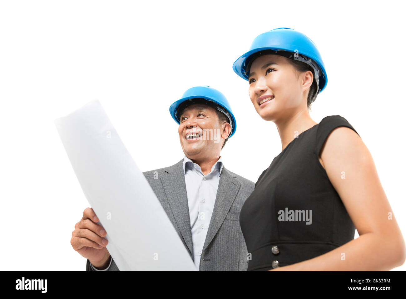 Construction engineer holding a drawing Stock Photo - Alamy