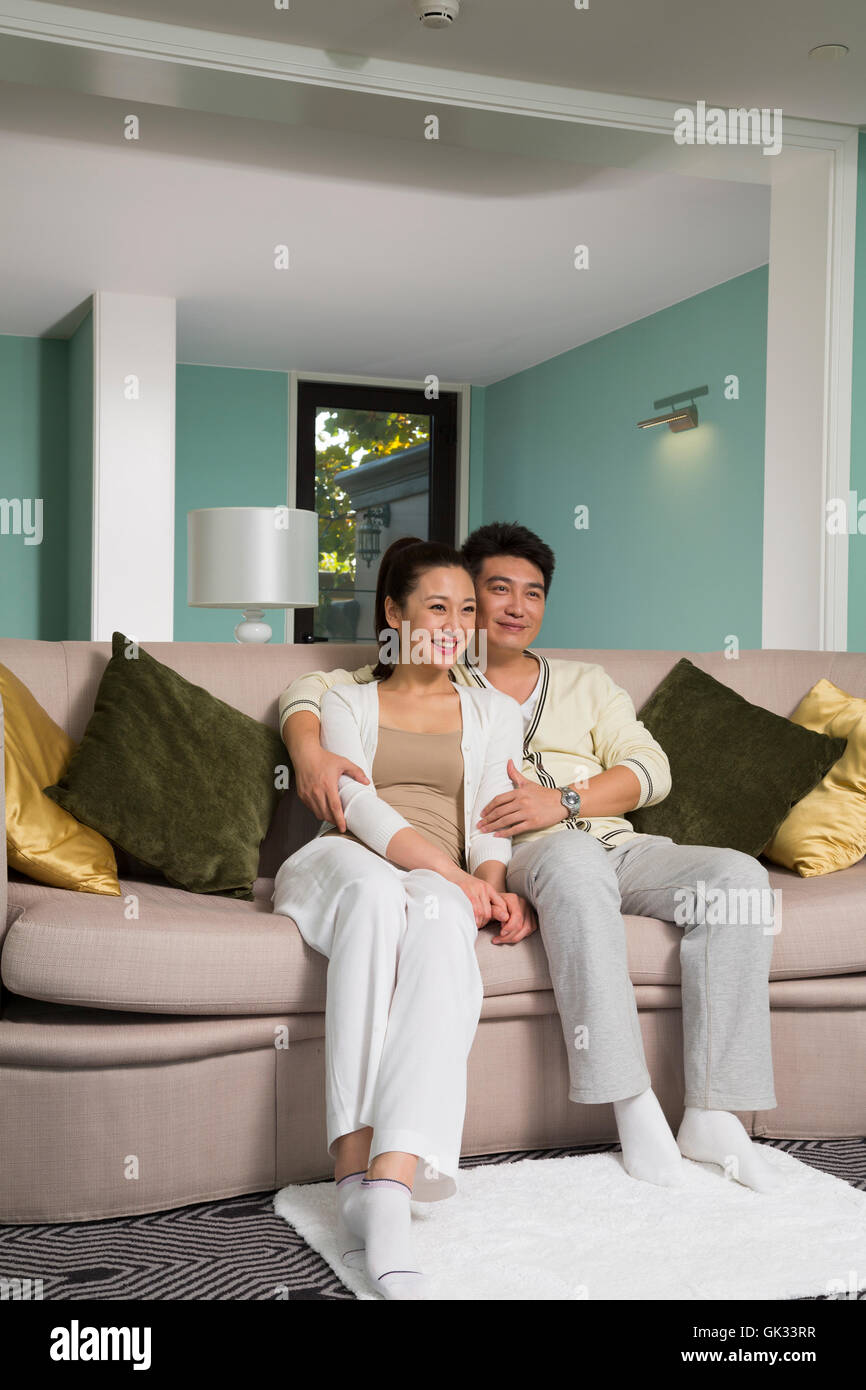 Couple in the living room Stock Photo - Alamy