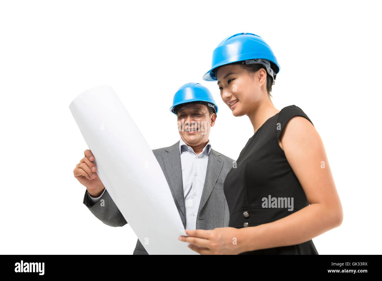 Construction engineer holding a drawing Stock Photo - Alamy