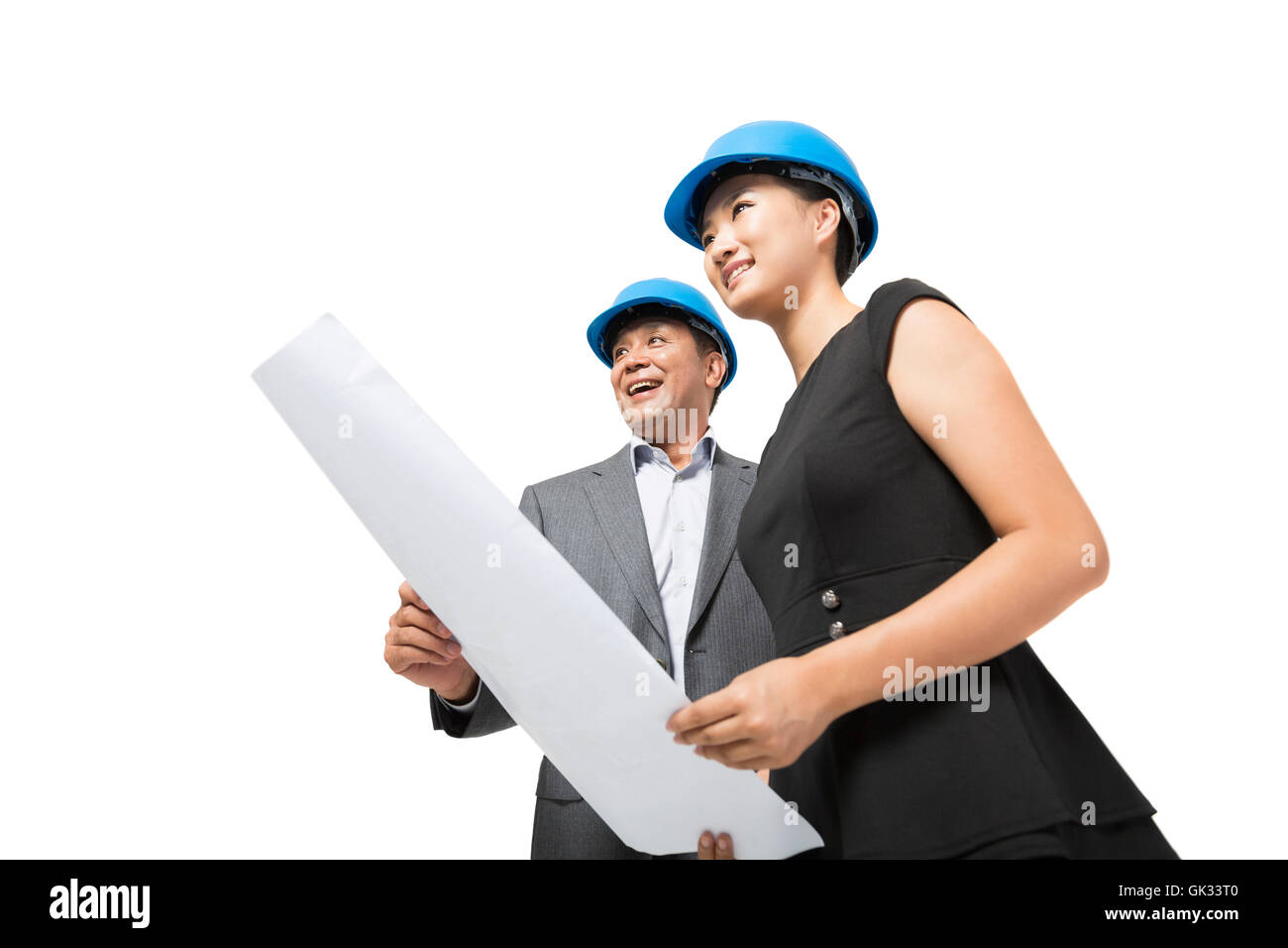 Construction engineer holding a drawing Stock Photo - Alamy