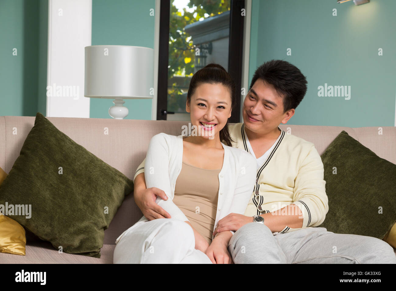 Couple in the living room Stock Photo - Alamy