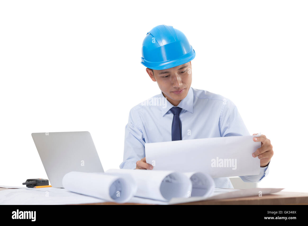 Research on young construction engineer drawings Stock Photo - Alamy