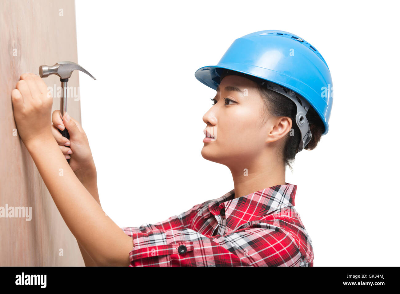 Young female construction worker nail Stock Photo - Alamy