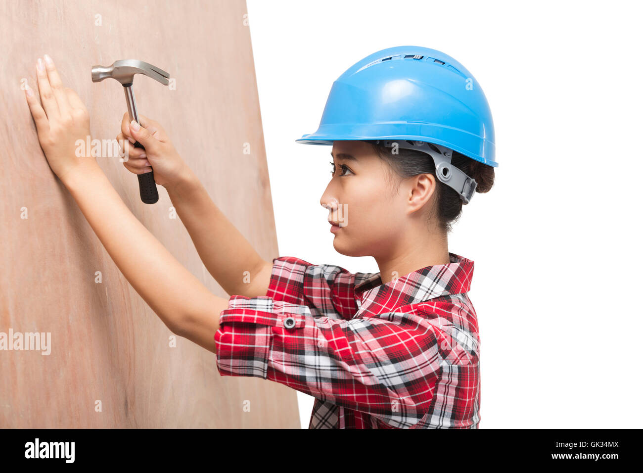 Young female construction worker nail Stock Photo - Alamy