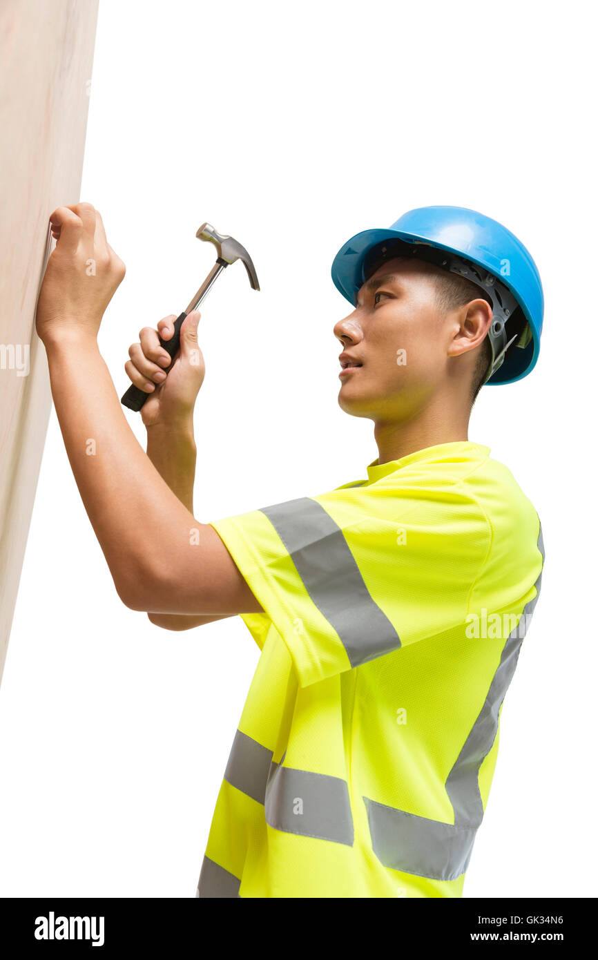 Young male construction worker nail Stock Photo - Alamy