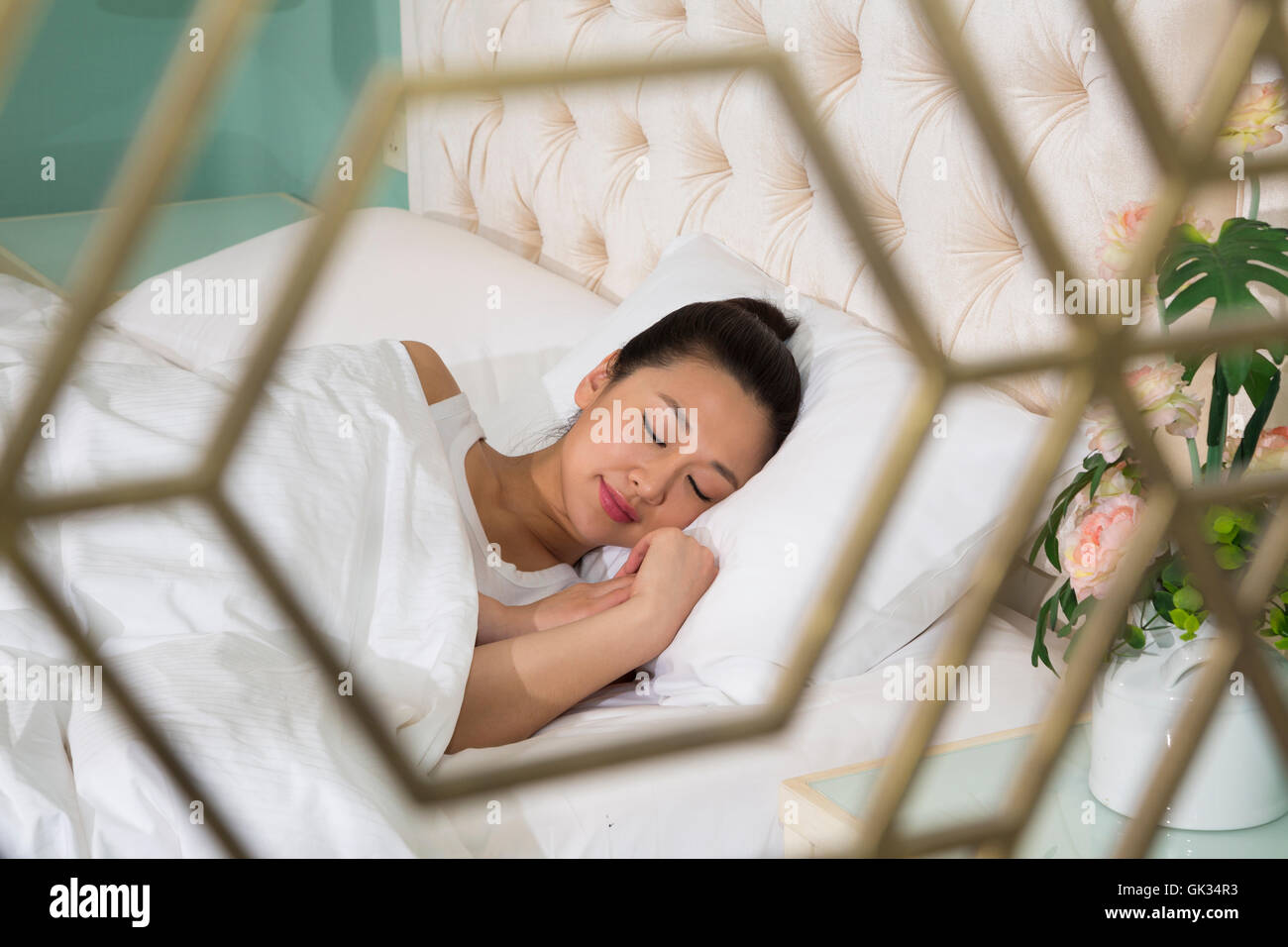 Young woman resting in the bedroom Stock Photo - Alamy
