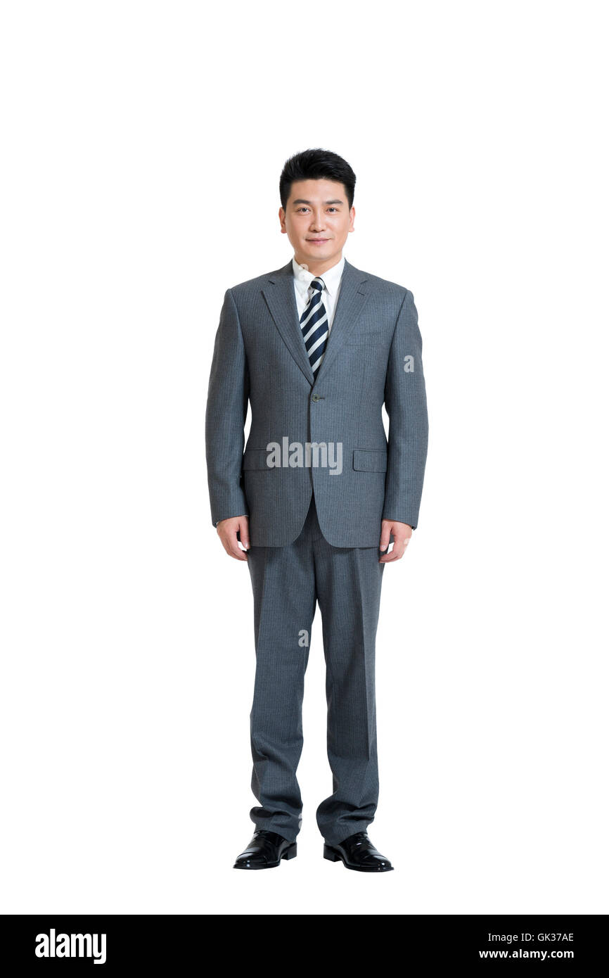 Studio shot business man standing Stock Photo - Alamy