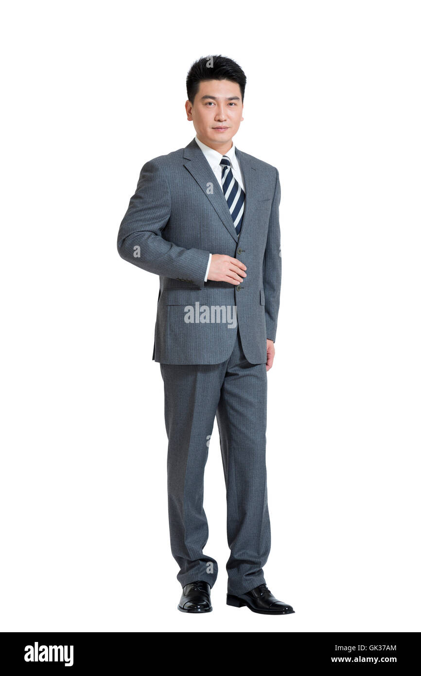 Studio shot business man standing Stock Photo - Alamy