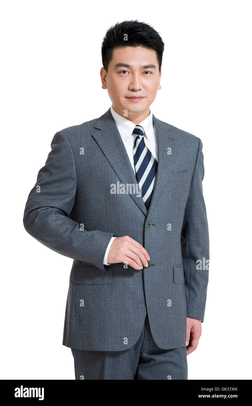 Studio shot business man standing Stock Photo - Alamy