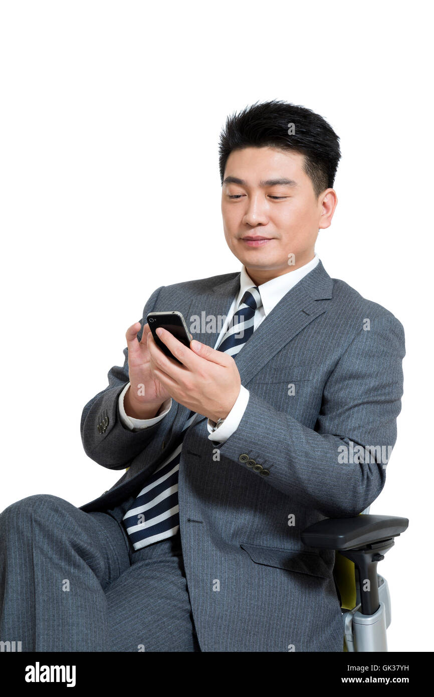Studio shot business man sitting in office chair Call Stock Photo - Alamy