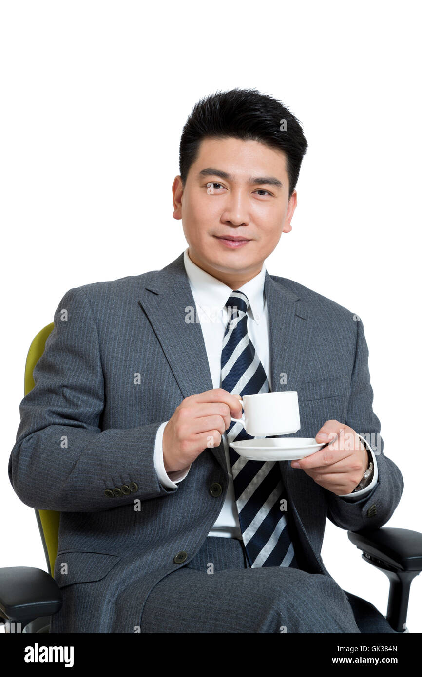 Studio shot business men sitting on office chair drinking coffee Stock ...