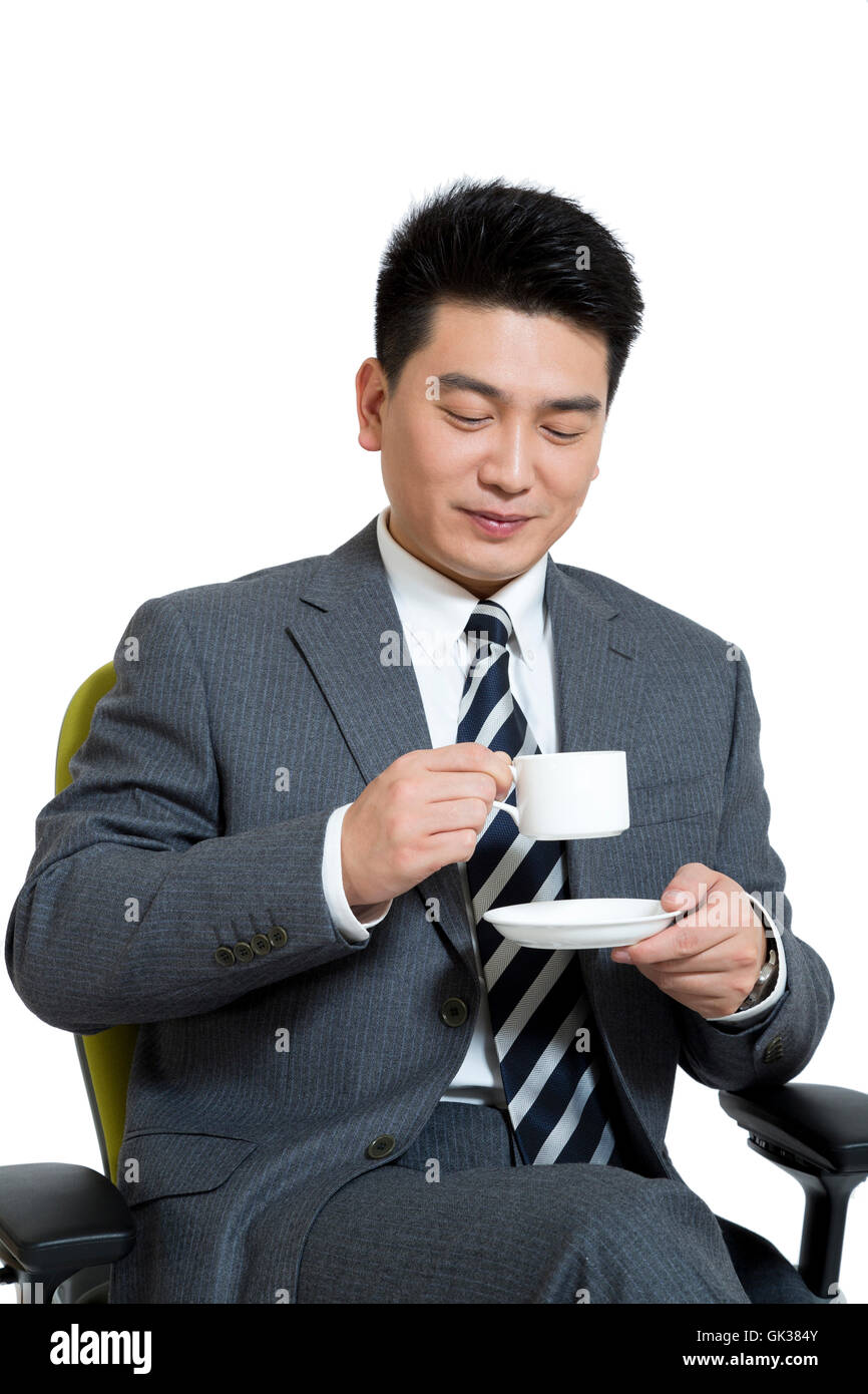 Studio shot business men sitting on office chair drinking coffee Stock ...