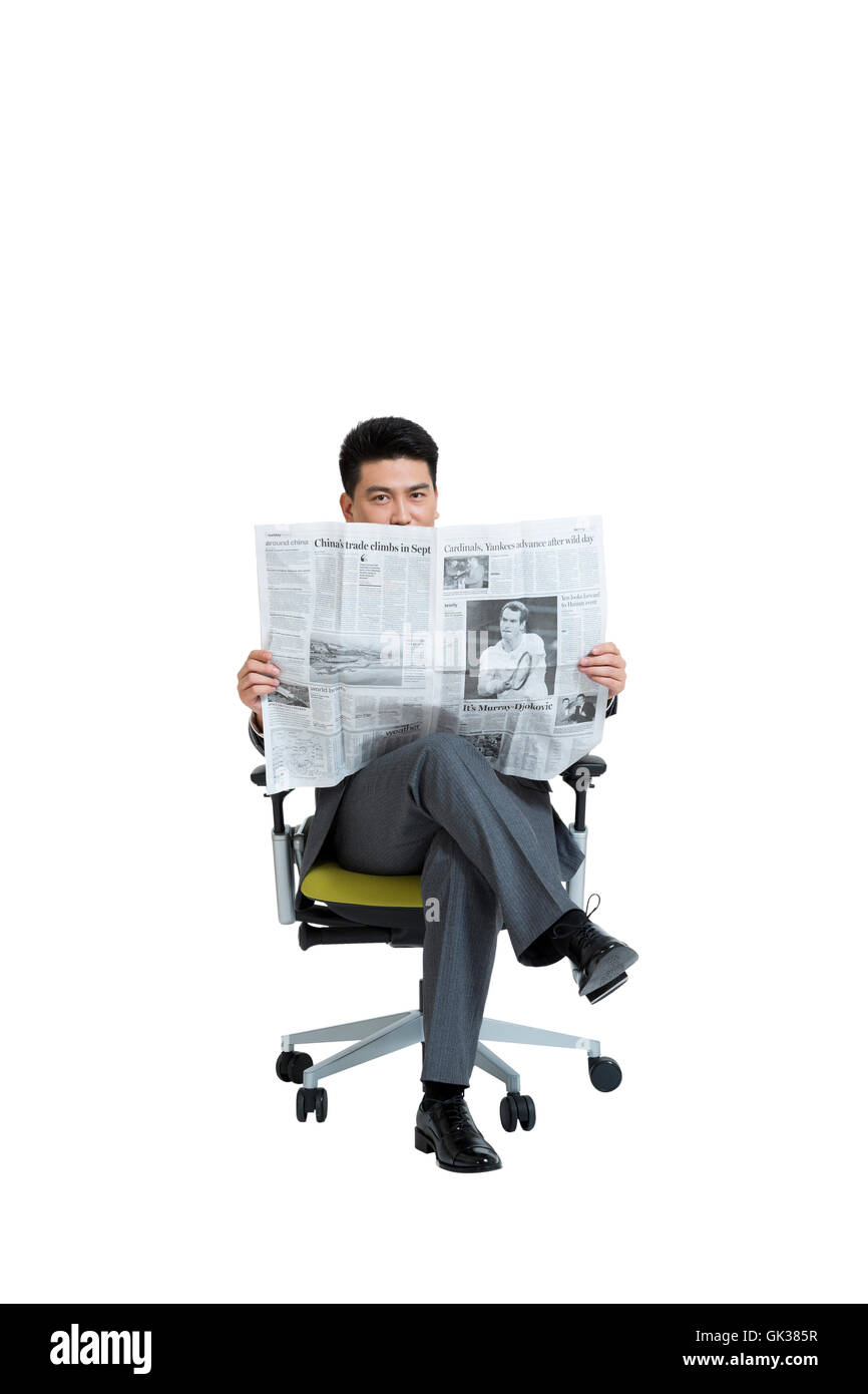 Man sitting on a chair reading a newspaper Cut Out Stock Images ...