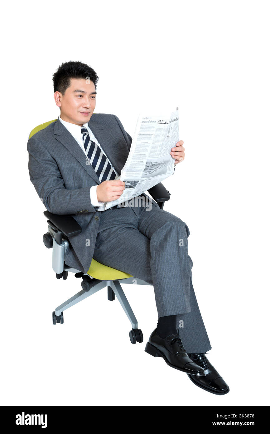 Man sitting on a chair reading a newspaper Cut Out Stock Images ...