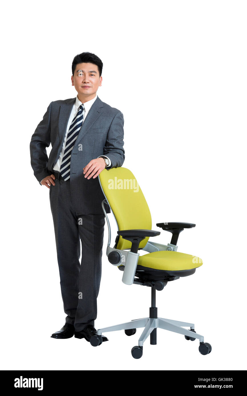 Business man standing next chair hi-res stock photography and images ...
