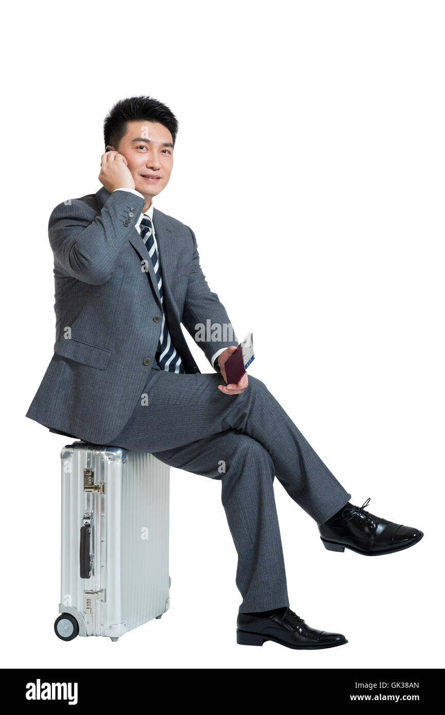Studio shot business man calling Stock Photo - Alamy