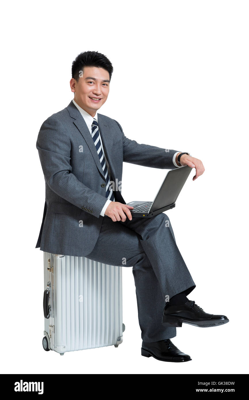 Studio shot business men using laptop Stock Photo - Alamy