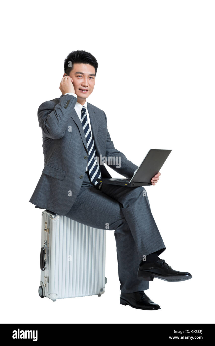 Studio shot business men using laptop Stock Photo - Alamy